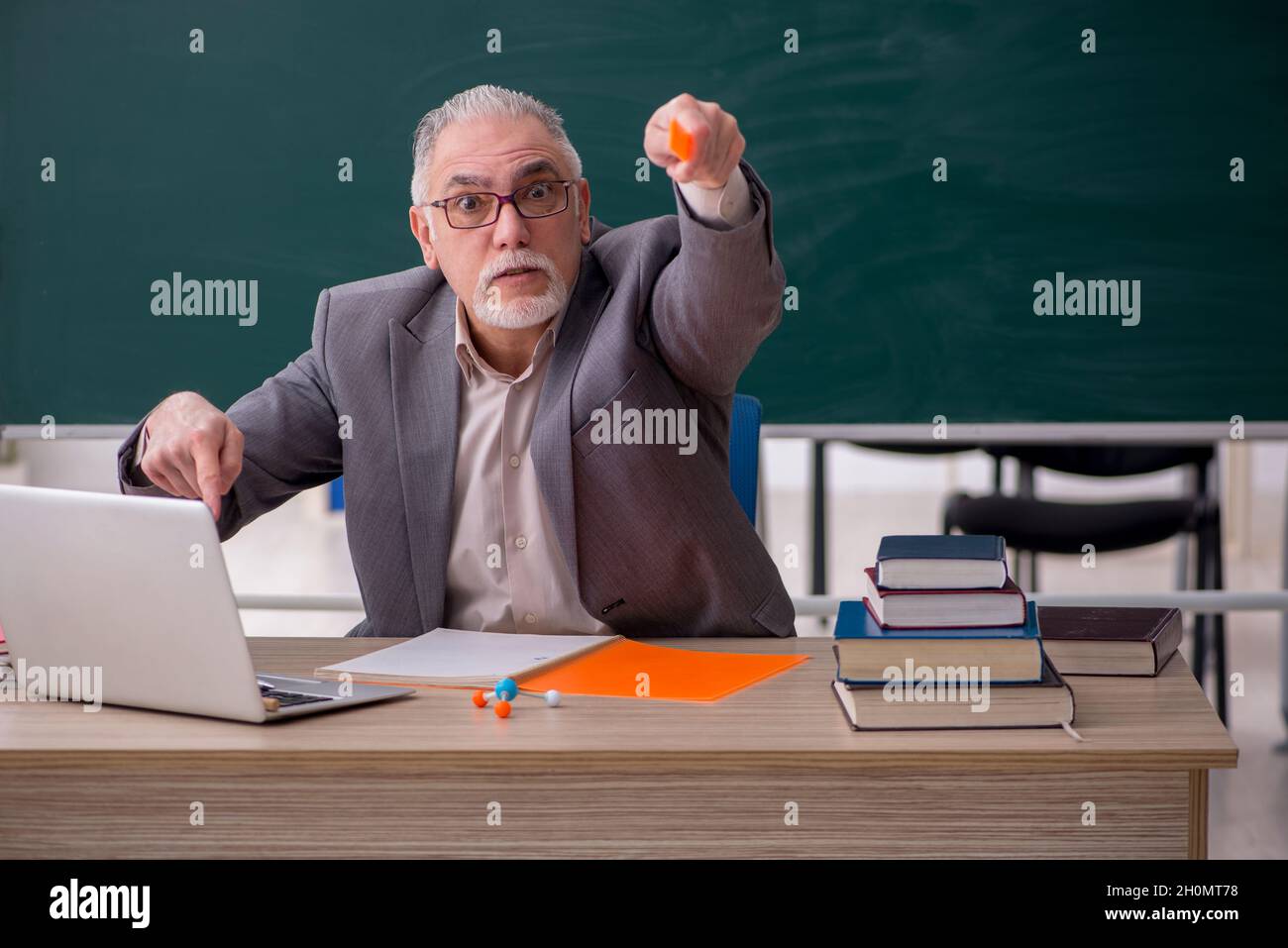 Angry teacher and ruler hi-res stock photography and images - Alamy