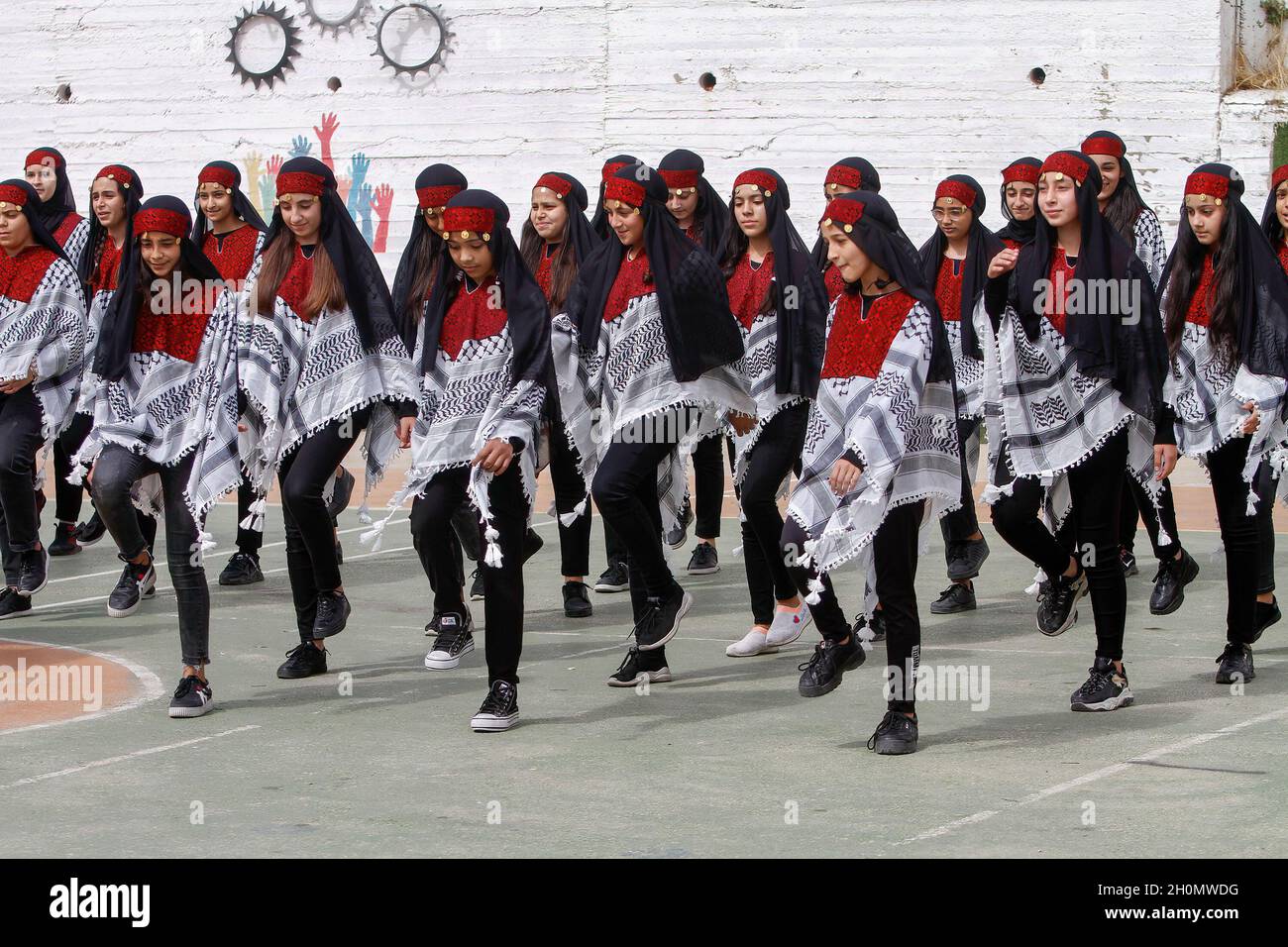 Palestinian students seen dancing while wearing the Palestinian ...