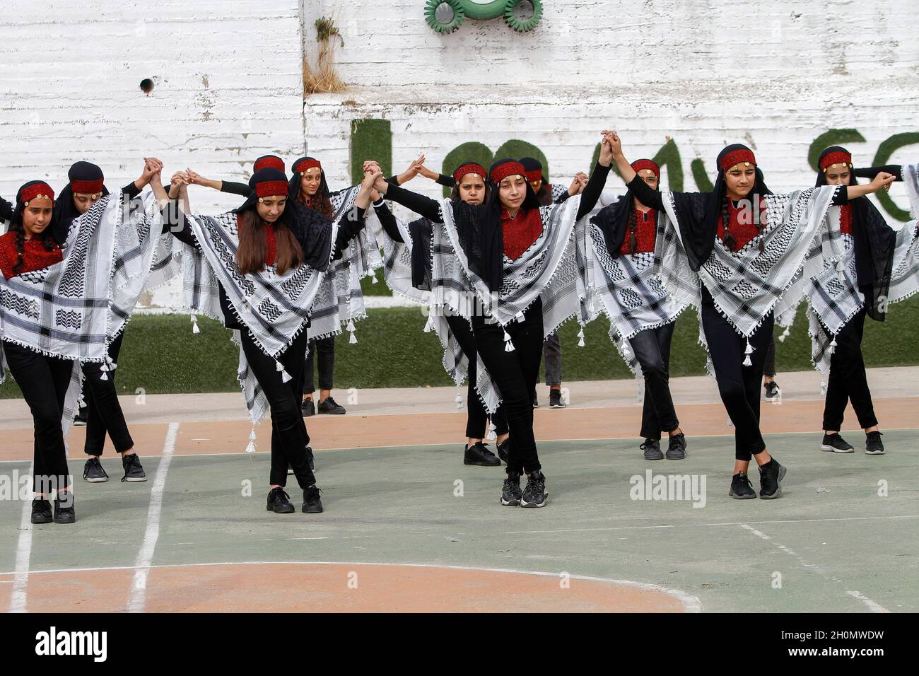 Palestinian students seen dancing while wearing the Palestinian ...