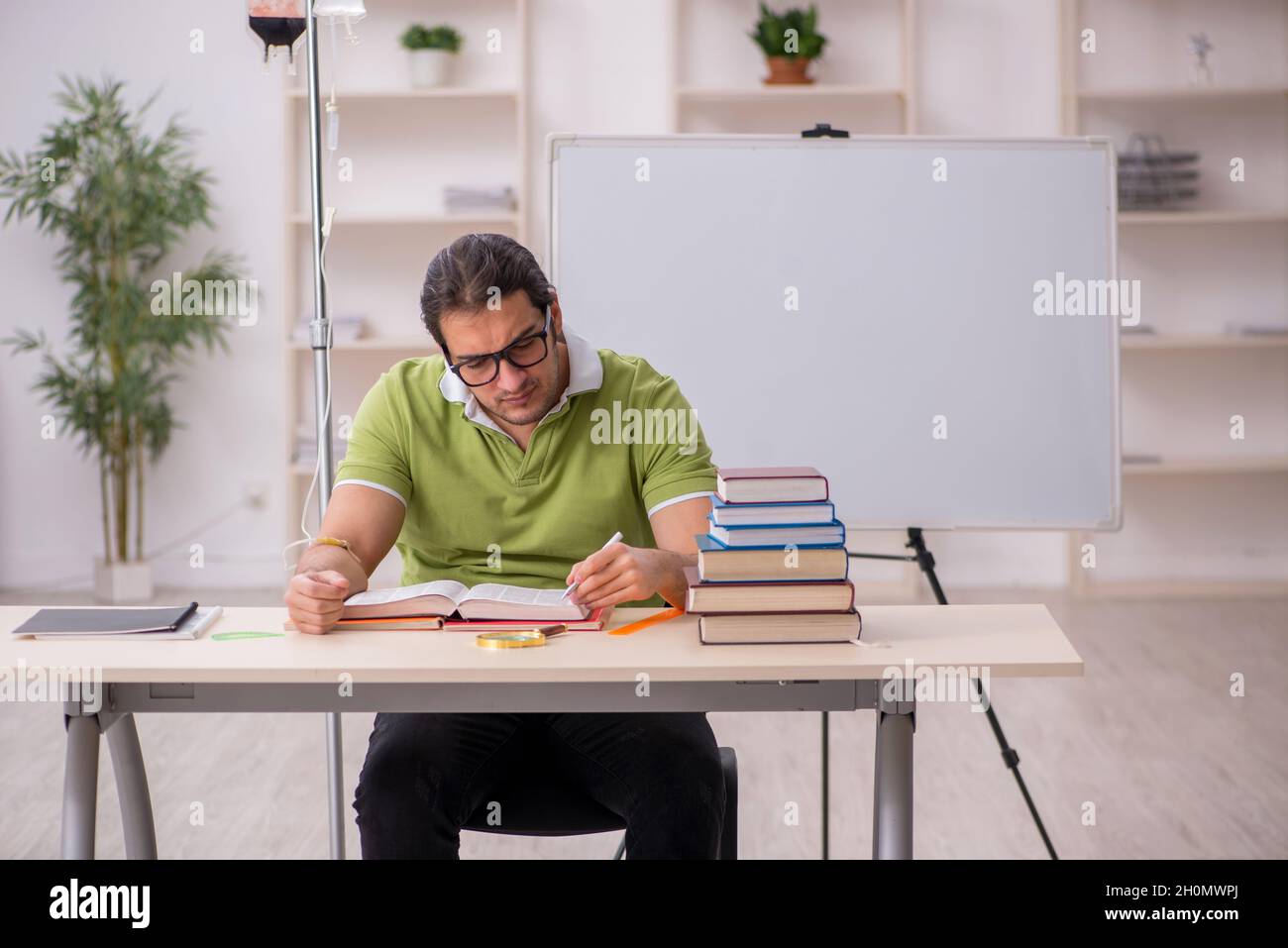 Young sick teacher student in blood transfusion concept Stock Photo - Alamy