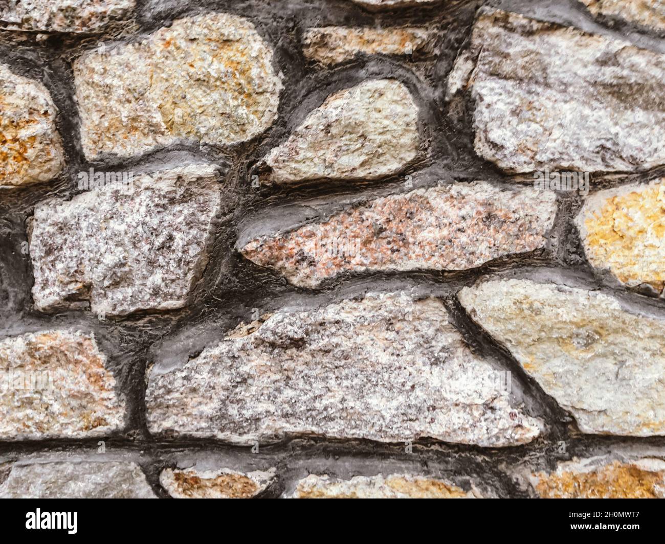 Front view of a vintage stone wall Stock Photo - Alamy