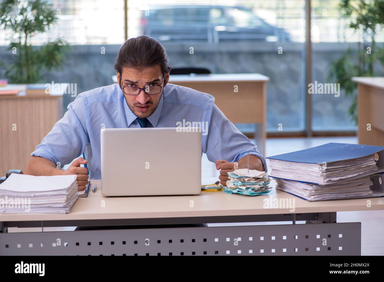 Young accountant working in the office Stock Photo - Alamy