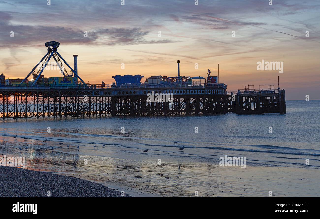 South Parade Pier on Southsea Beach at sunrise with a low tide and blue ...