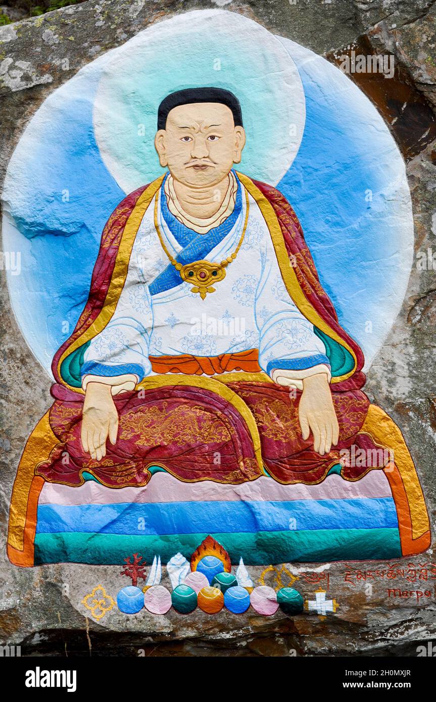 A colourful rock painting of Marpa (from the Buddhist religion) on a ...