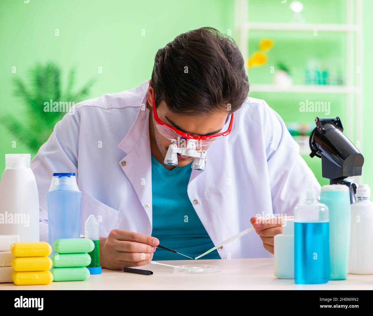 Chemist testing soap in hi-res stock photography and images - Alamy