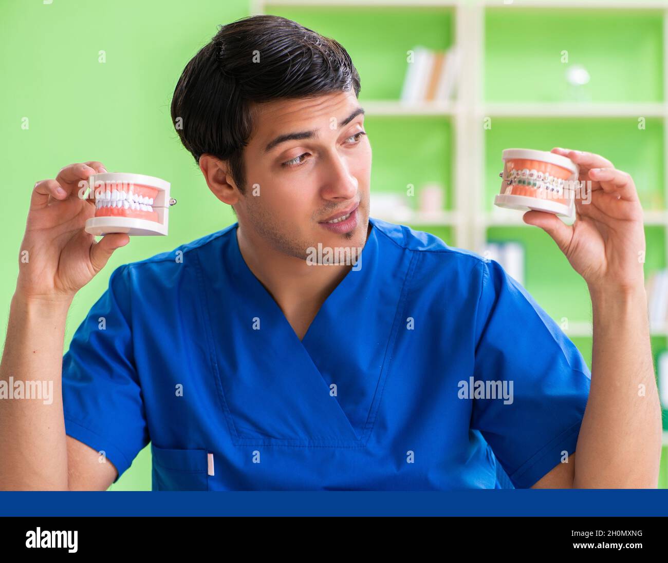 The man dentist working on new teeth implant Stock Photo - Alamy