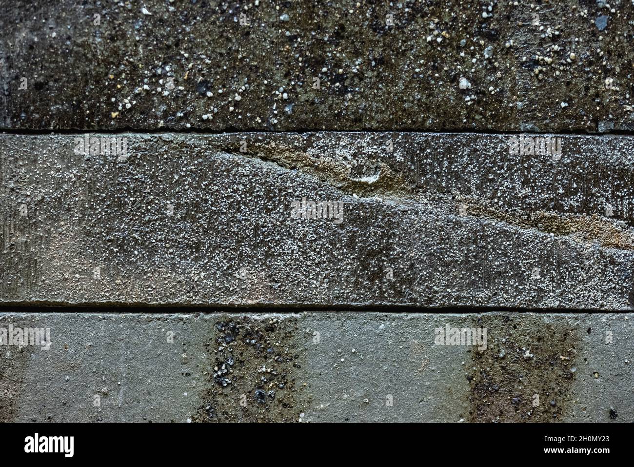 Close-up texture of a gray decorative scratched brick with a gap Stock ...