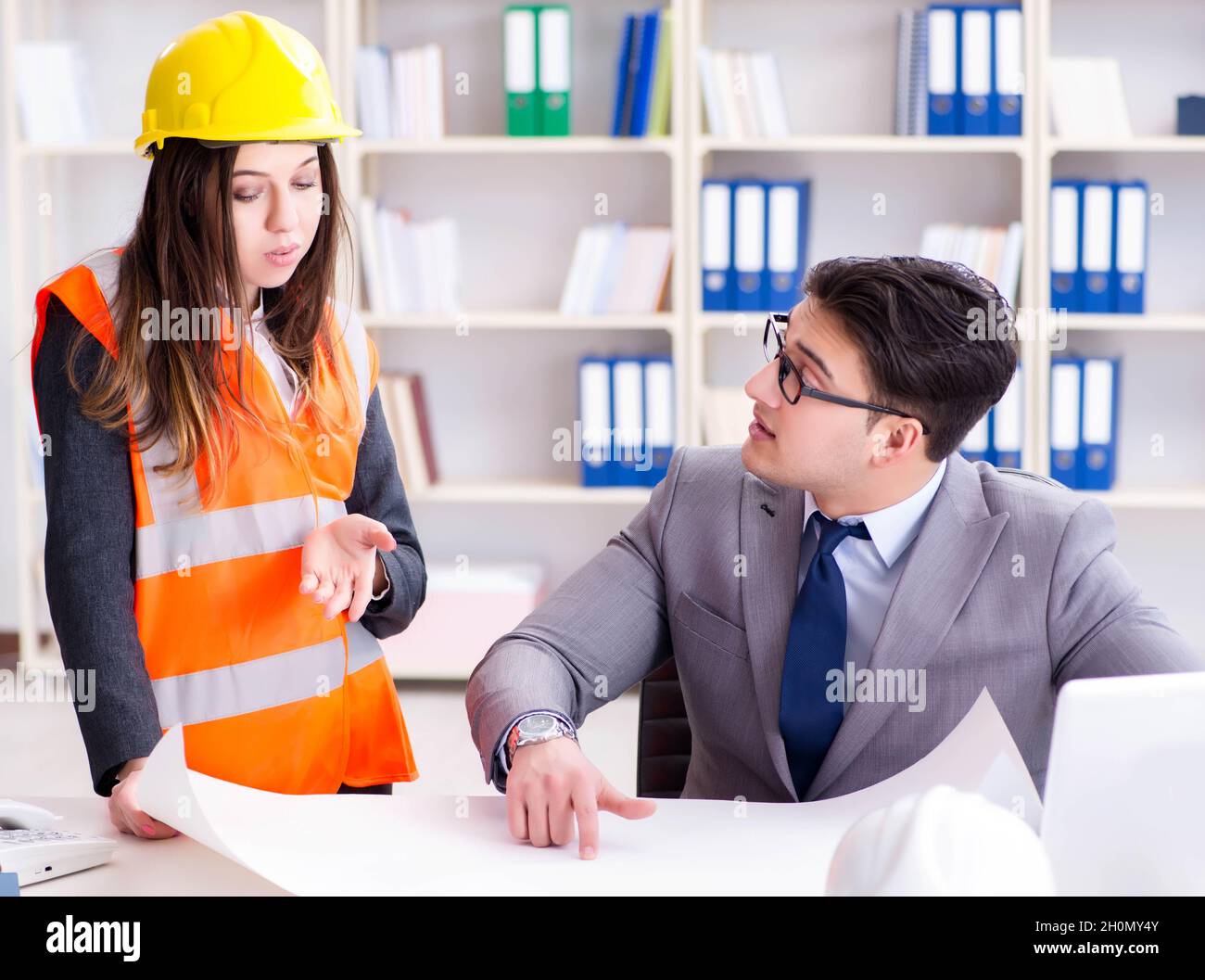 The construction foreman supervisor reviewing drawings Stock Photo - Alamy