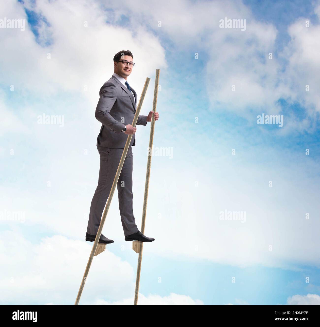 The businessman walking on stilts - standing out from the crowd Stock ...