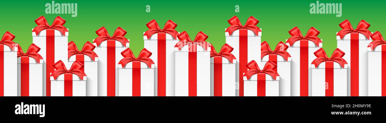 A row of white gift boxes wrapped with red ribbons, standing on a green ...