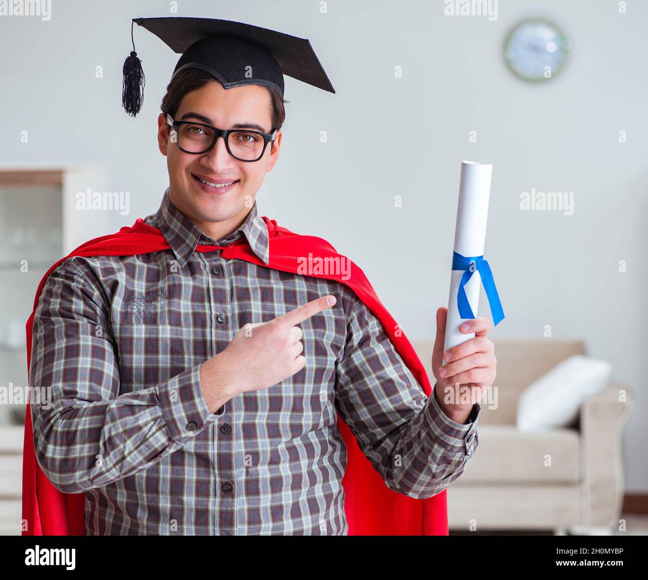 The super hero student with books studying for exams Stock Photo - Alamy