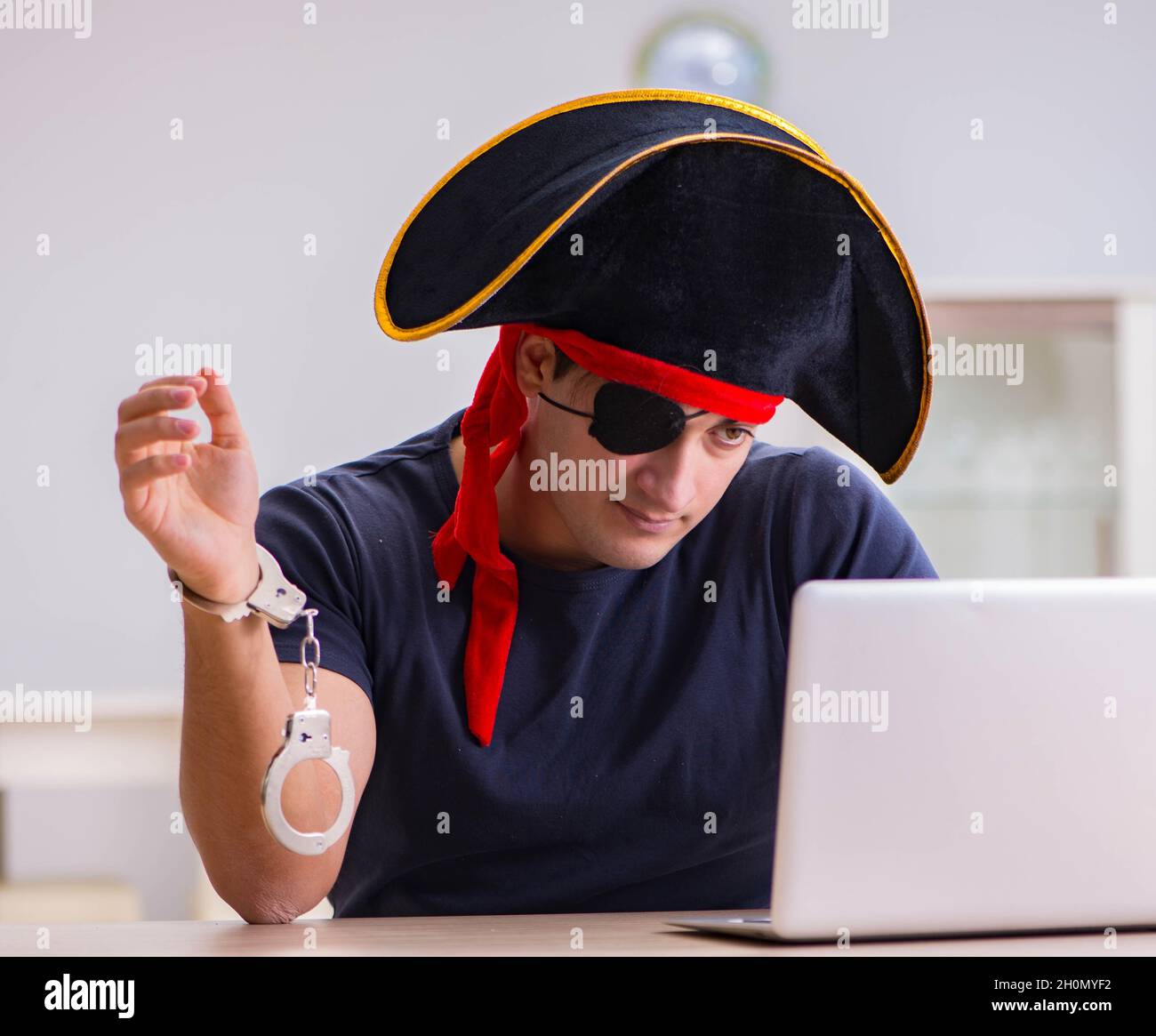 The digital security concept with pirate at computer Stock Photo - Alamy