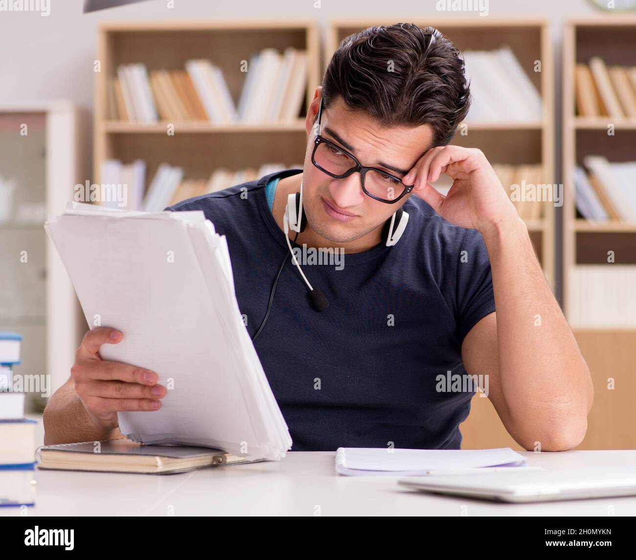 Unhappy teenager reading book hi-res stock photography and images - Alamy