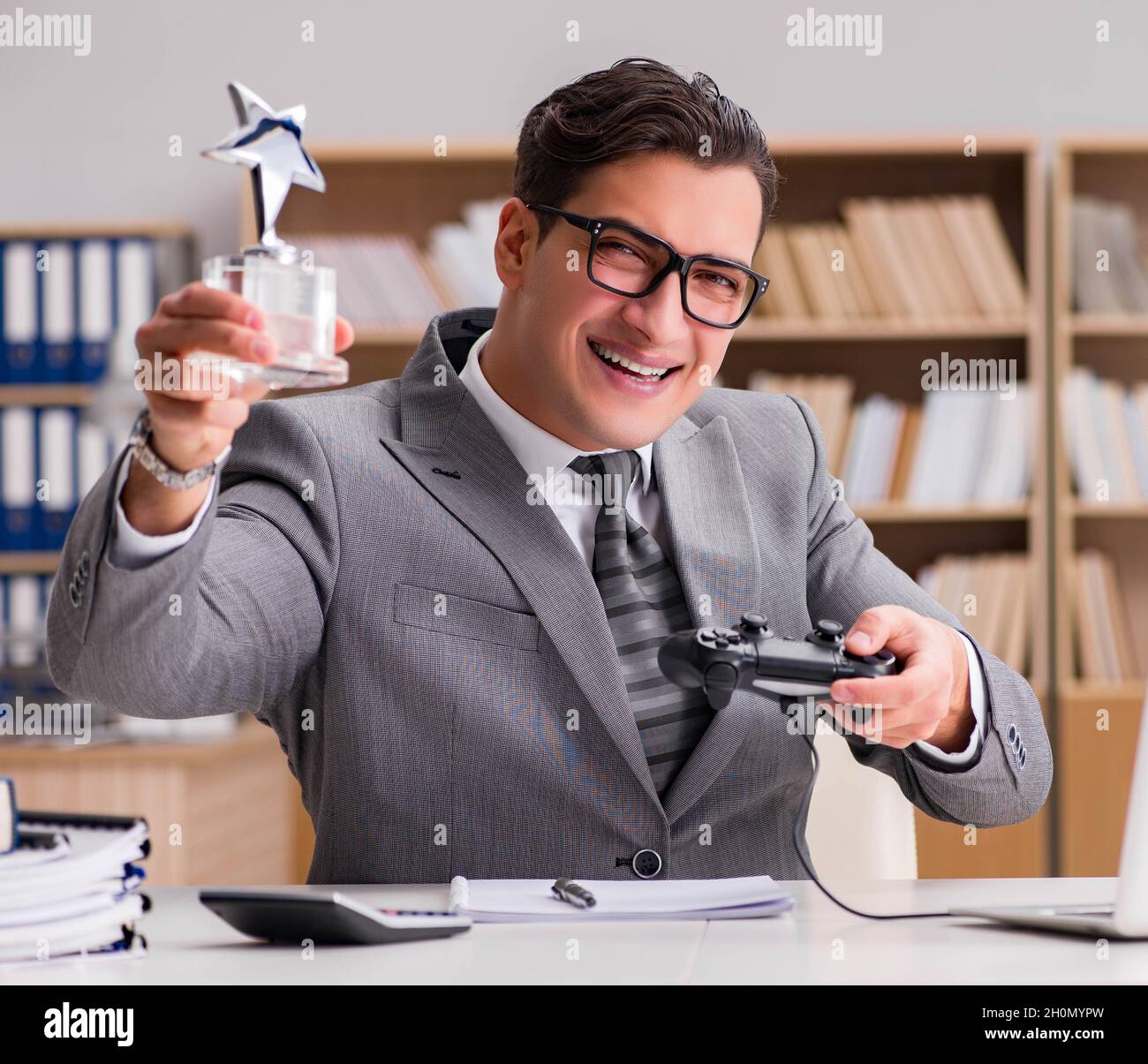 The businessman playing computer games at work office Stock Photo - Alamy