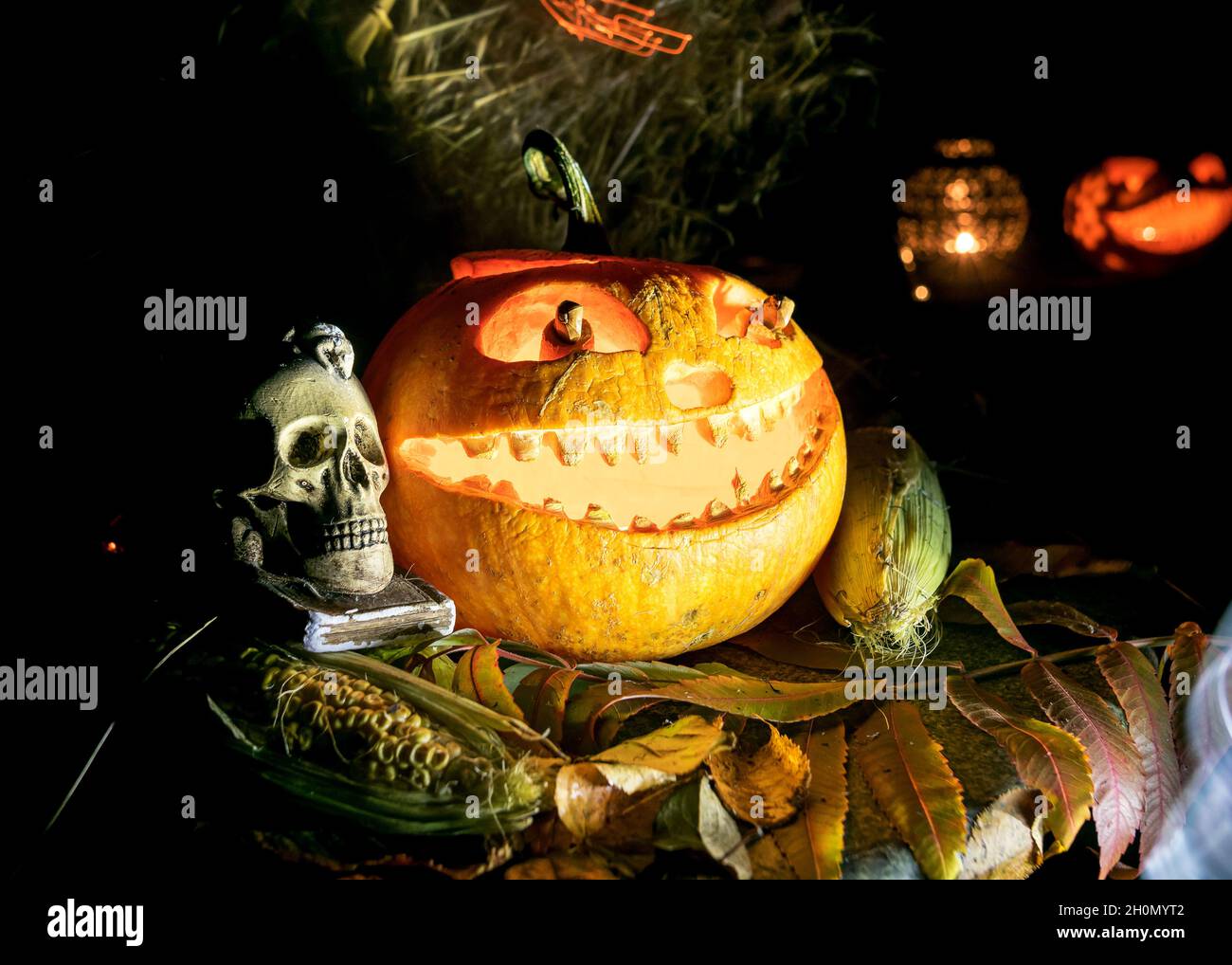 halloween composition with smiling pumpkins in the dark, and halloween ...