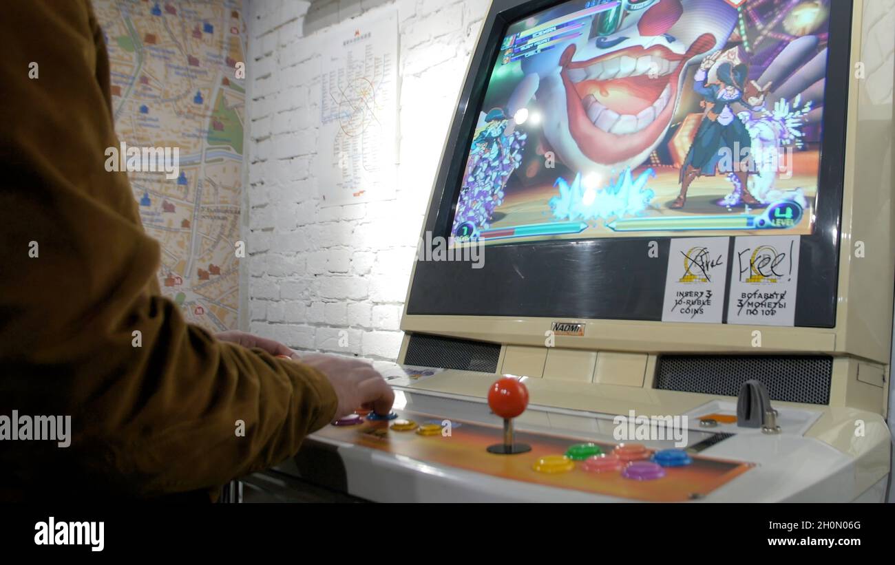 Man playing old game console. Joystick of a vintage arcade videogame ...