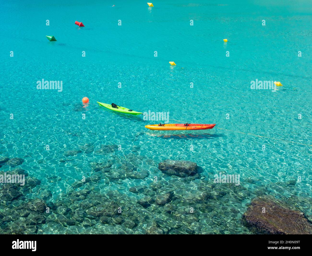 Kayaks floating in the turquoise waters Stock Photo - Alamy