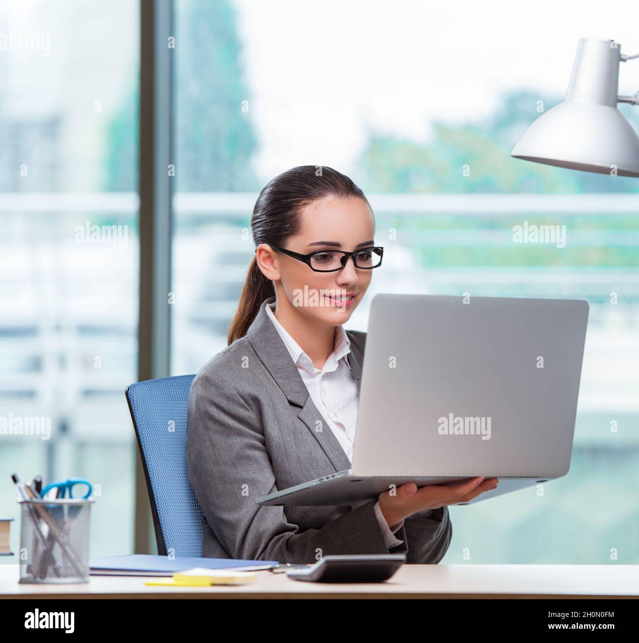 The young assistant working in the office Stock Photo - Alamy