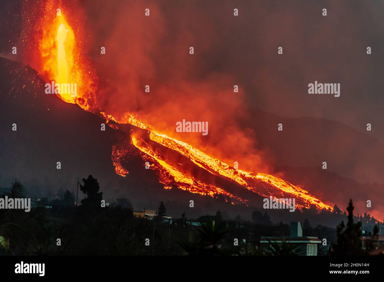 Lava fountains and multiple lava flows descend from the active crater ...