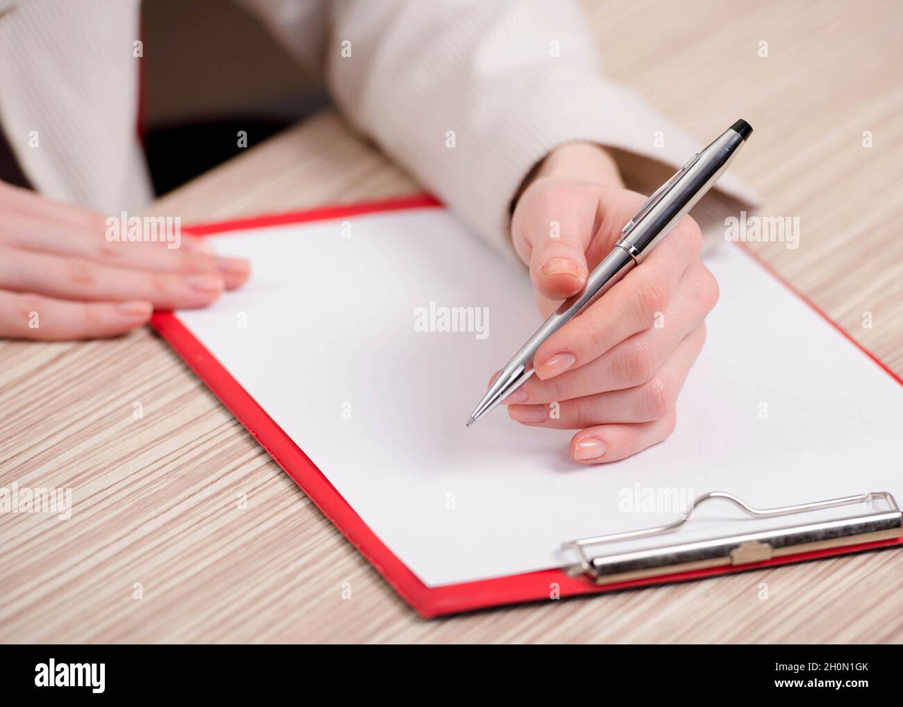The hands taking notes in the pad Stock Photo - Alamy