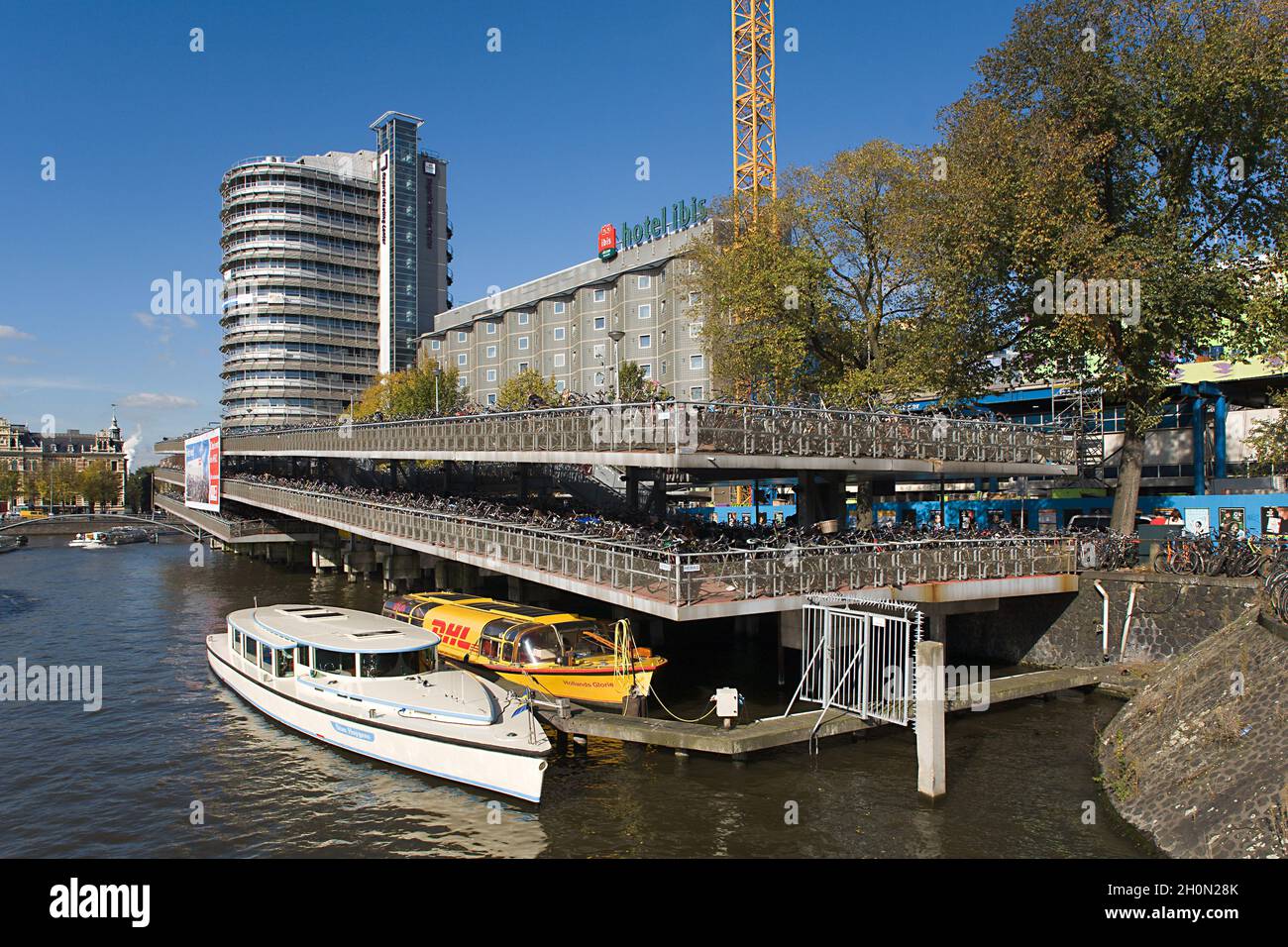 NETHERLANDS, NORTH HOLLAND, AMSTERDAM. FLOATING BICYCLE GARAGE NEAR ...
