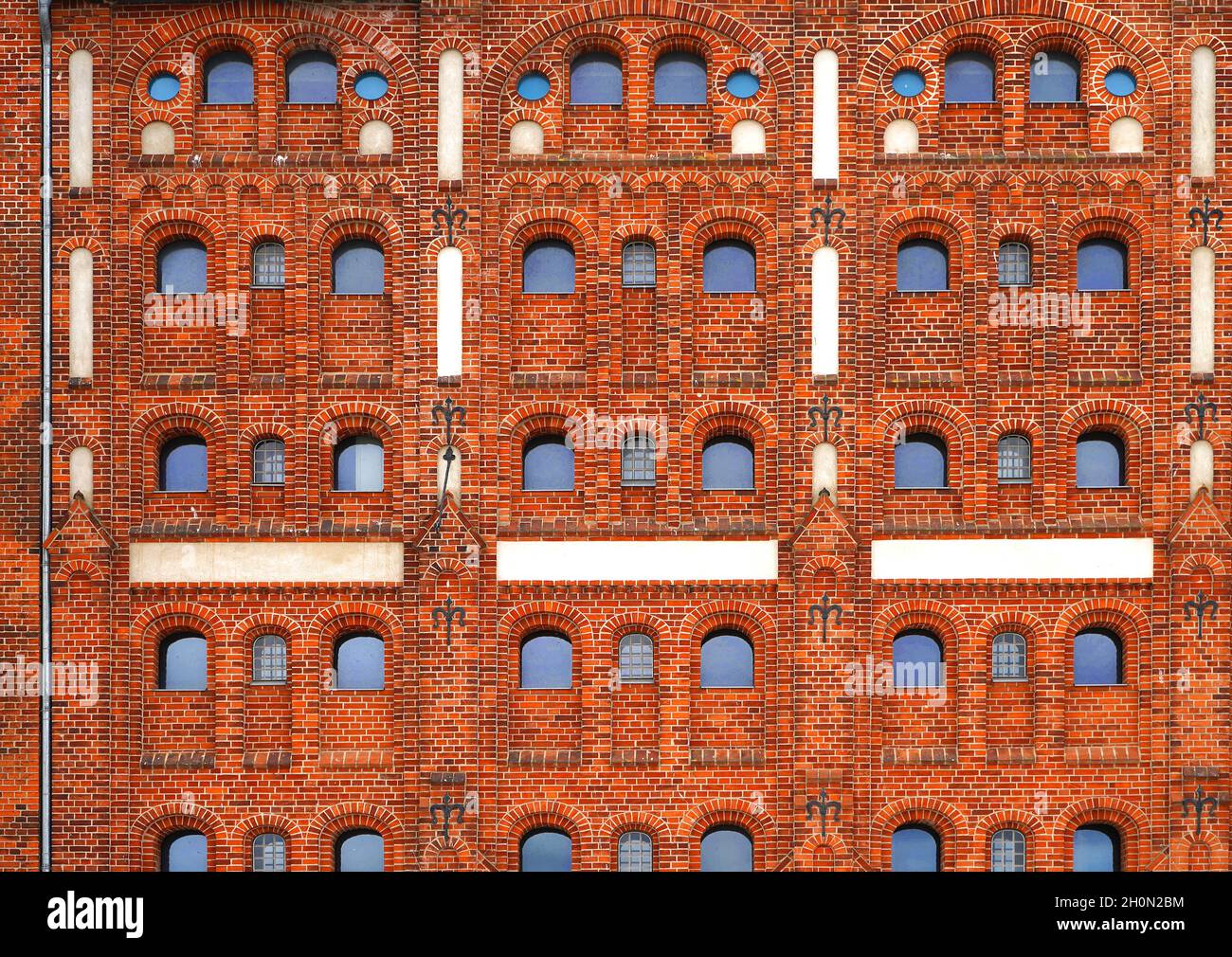 Red brick wall lines and windows Stock Photo - Alamy
