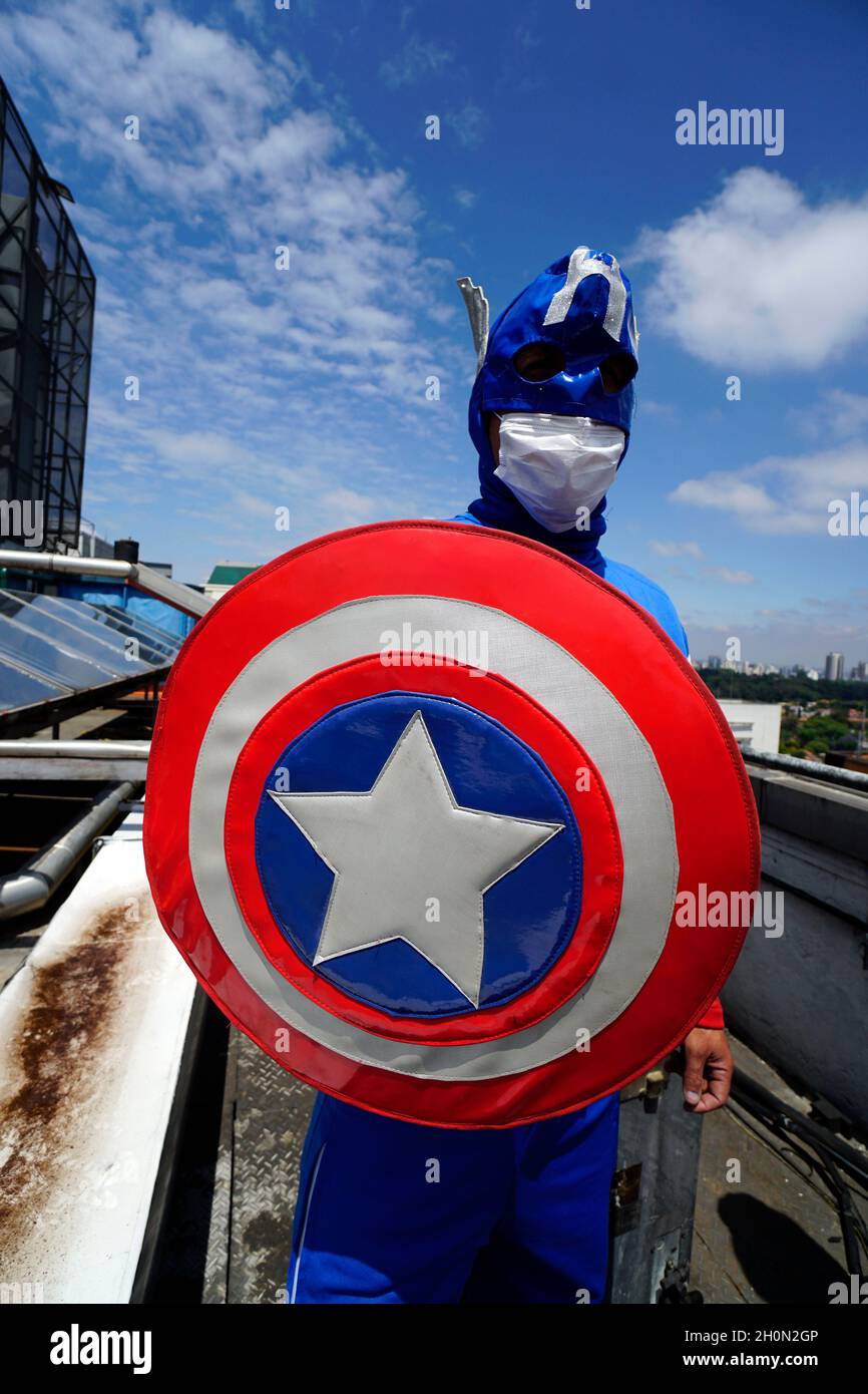 October 12, 2021: Window cleaners wearing superhero costumes greet a ...