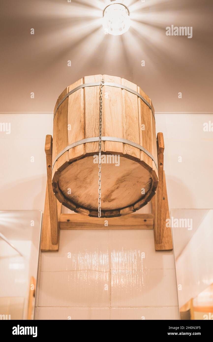 Wooden bucket with cold water for dousing after a sauna and a bath ...