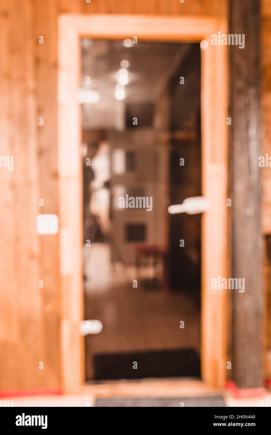 Defocus glass door made of tinted glass and light wood finish Stock ...