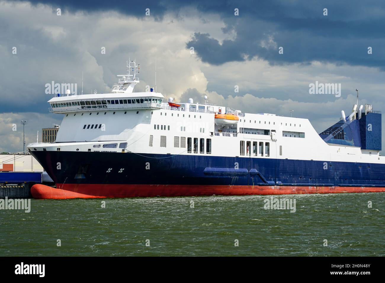 Waterfront with freighter in background hi-res stock photography and ...