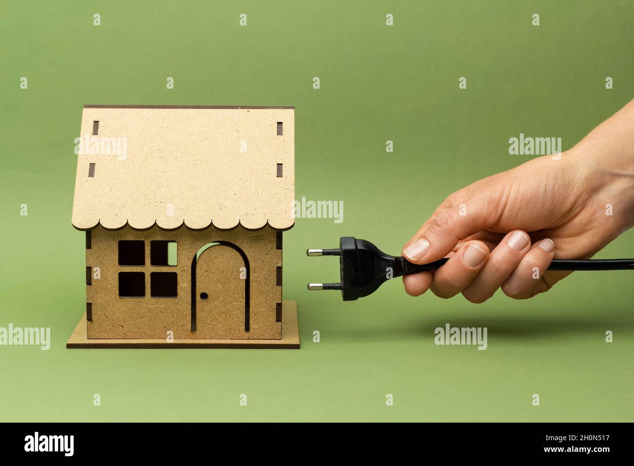 Residential building electrification. Electric plug, green energy Stock ...