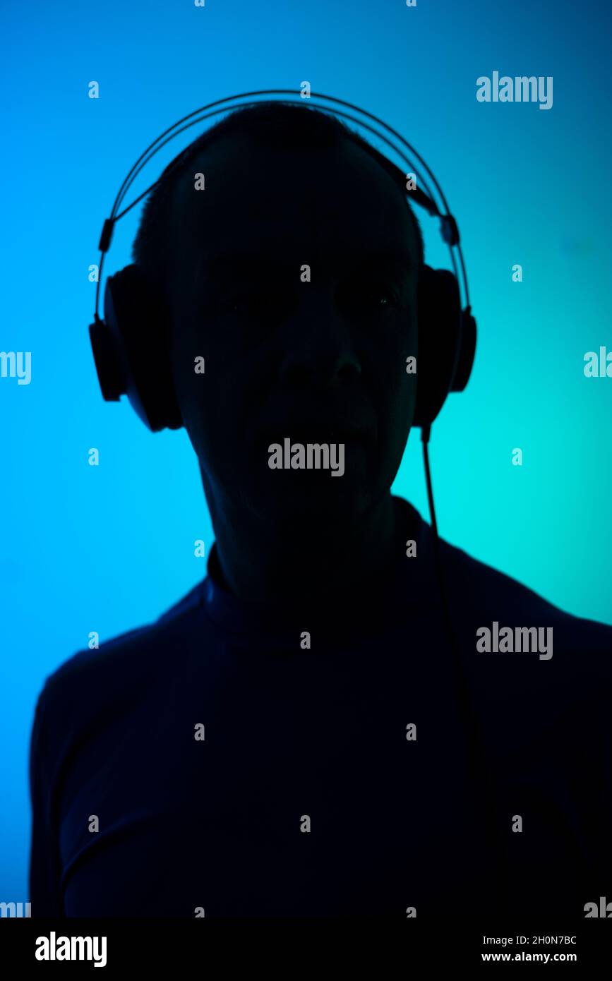 Dj deejay electronic wearing music headphones with coloured lights ...