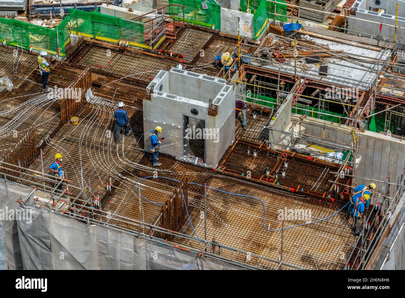 SINGAPORE, SINGAPORE - Oct 11, 2021: Workers at public housing HDB ...