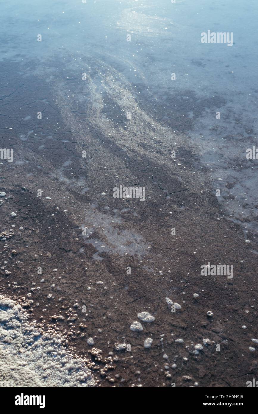 Close-up shot of salt flats in water Stock Photo - Alamy