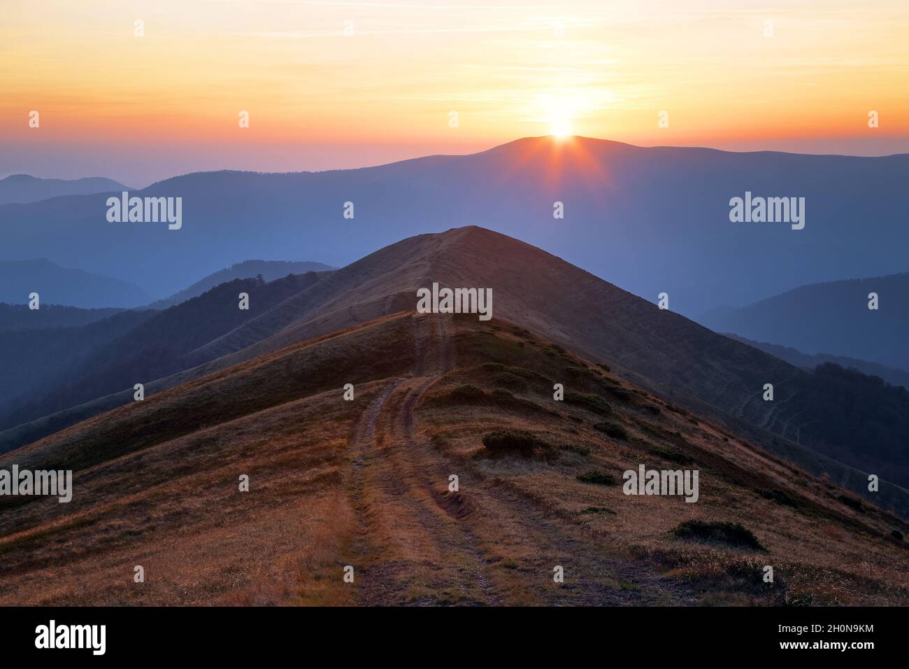 Autumn scenery. Mountain landscape with beautiful sunset, road ...