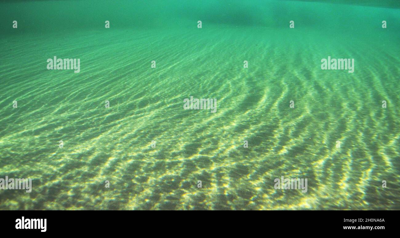 Mesmerizing view of under the sea with sunshine reflections Stock Photo ...