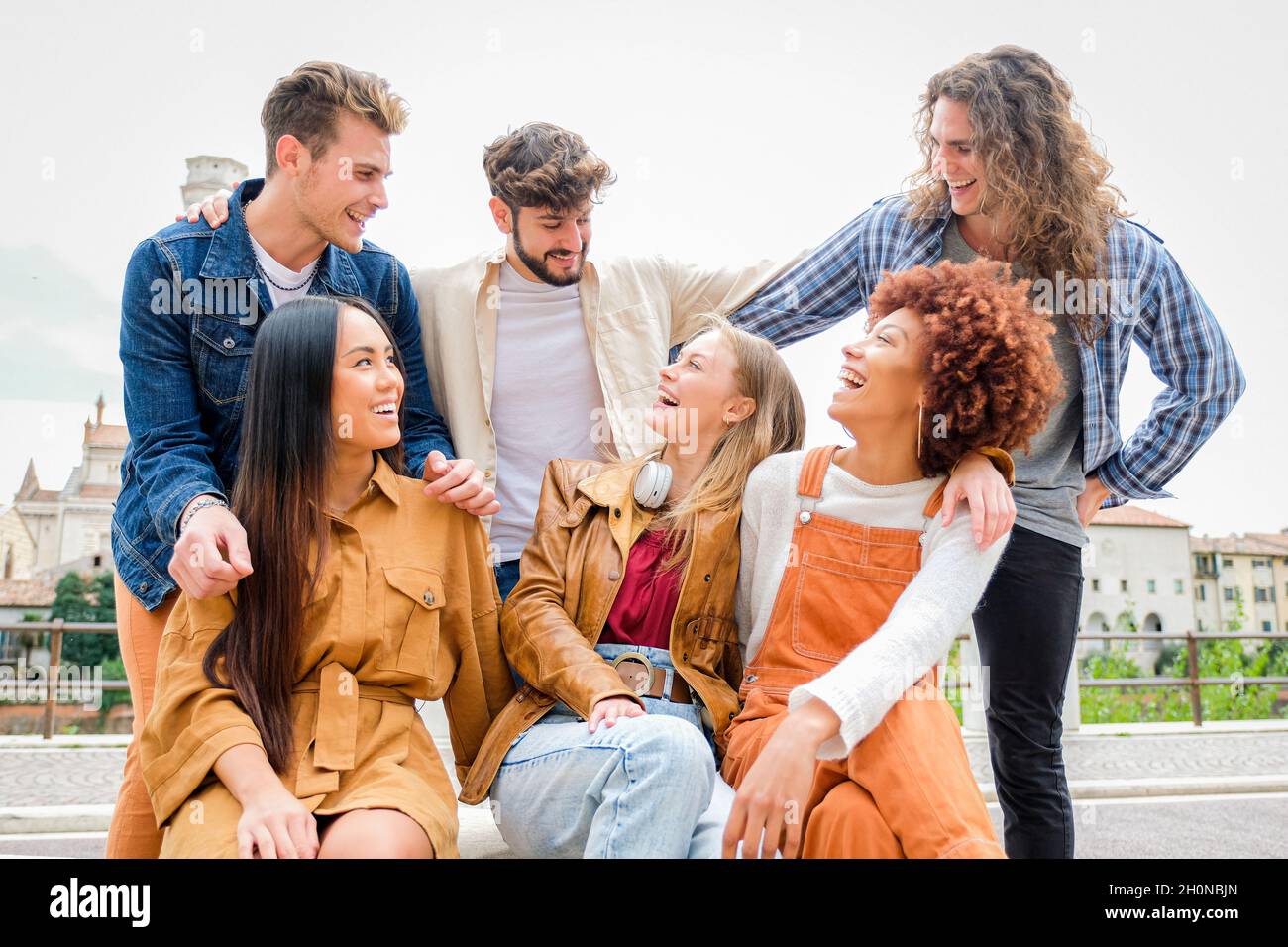 Group of multiracial friends having fun on the city streets - Young ...