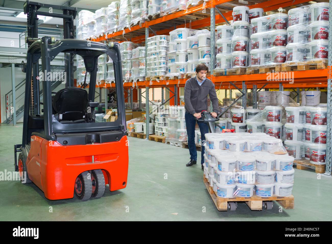 storehouse employee during driving on forklift in warehouse Stock Photo ...