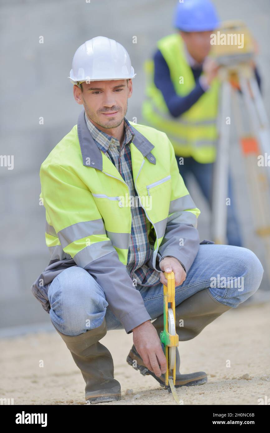 builders are using to measure the height of the cement Stock Photo - Alamy