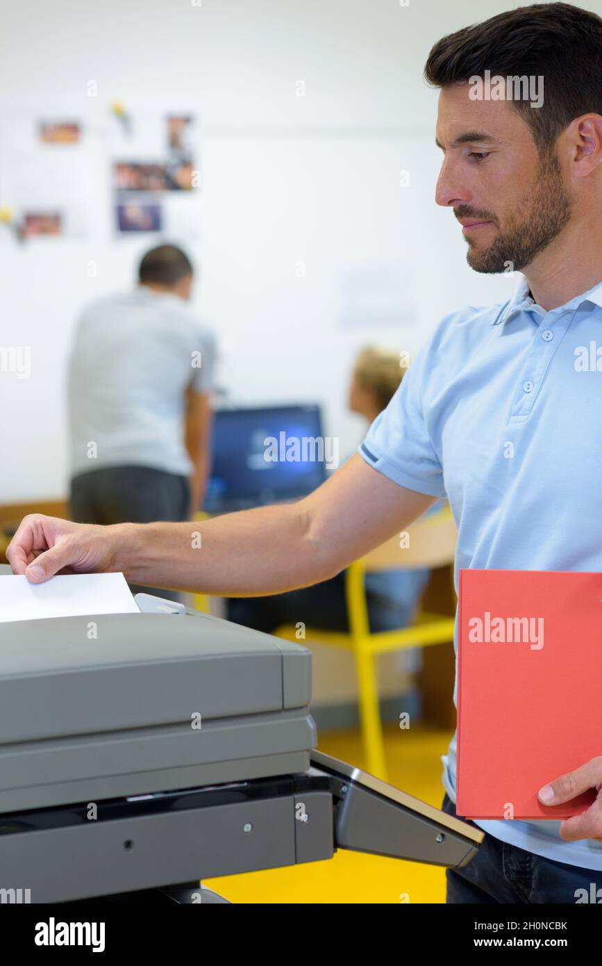 business man making a photocopy at the photocopier Stock Photo - Alamy