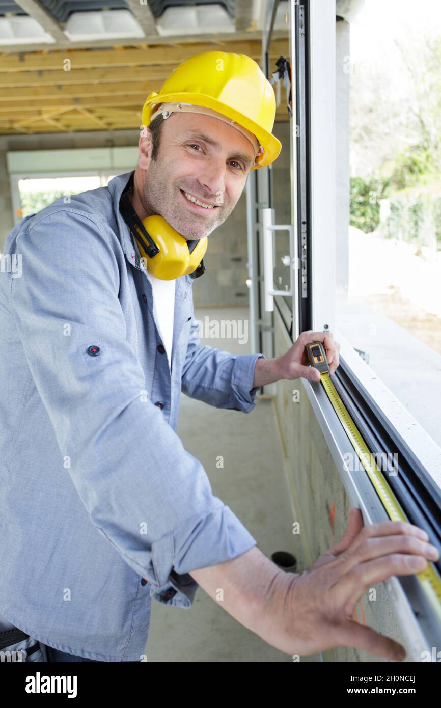 Man measuring window frame hi-res stock photography and images - Alamy