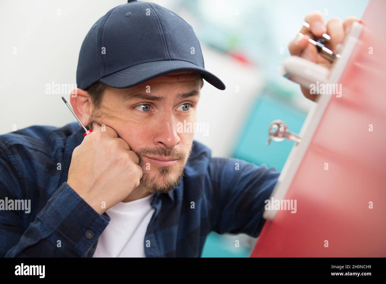 Carpenter install door lock hi-res stock photography and images - Alamy