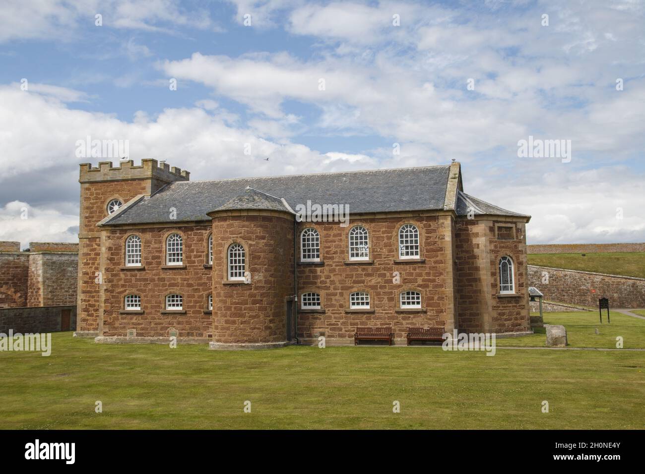 Beautiful view with blue sky, white clouds and green grass on Fort ...