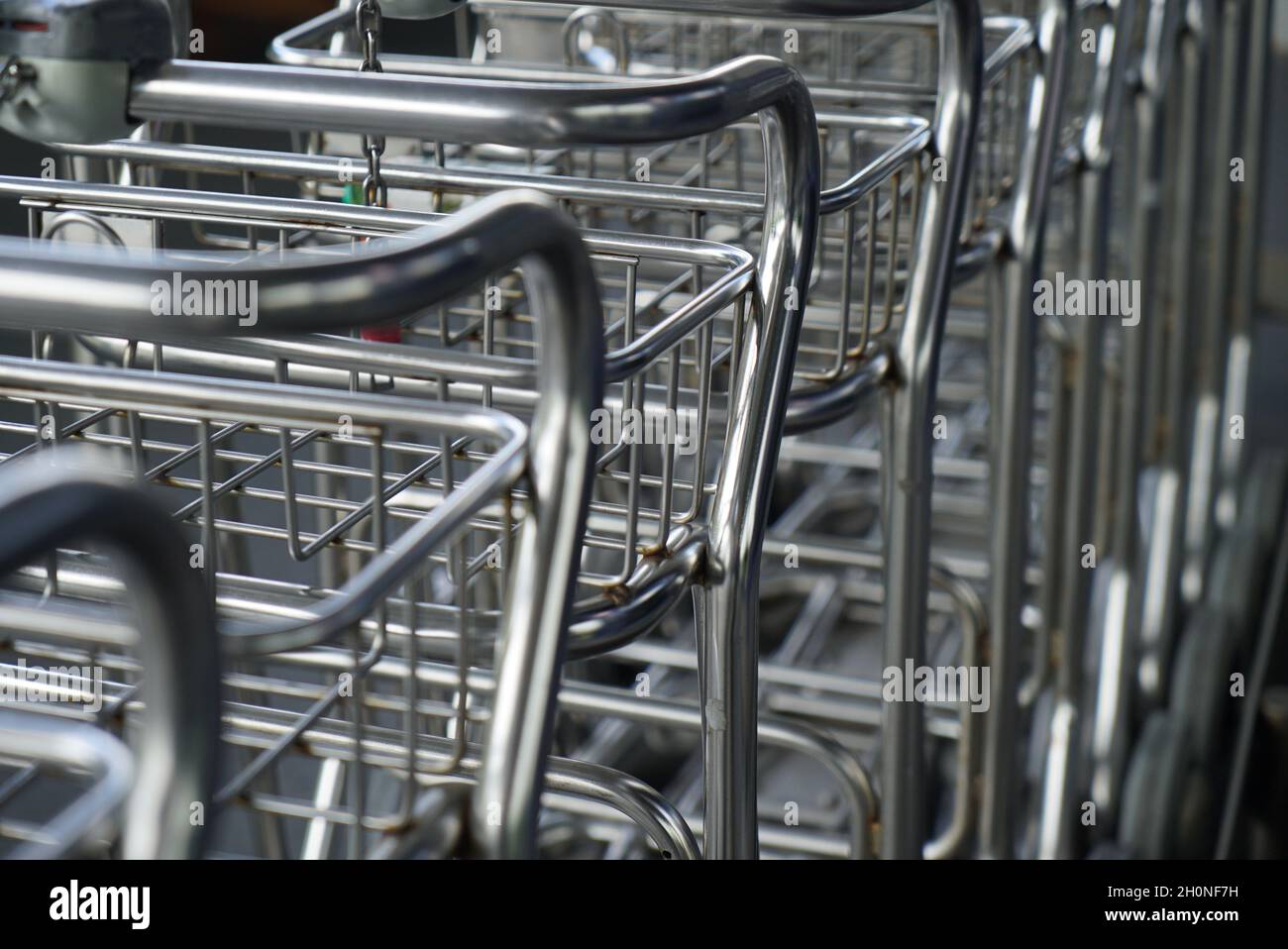 Closeup shot of supermarket shopping carts stacked together in a row Stock Photo - Alamy