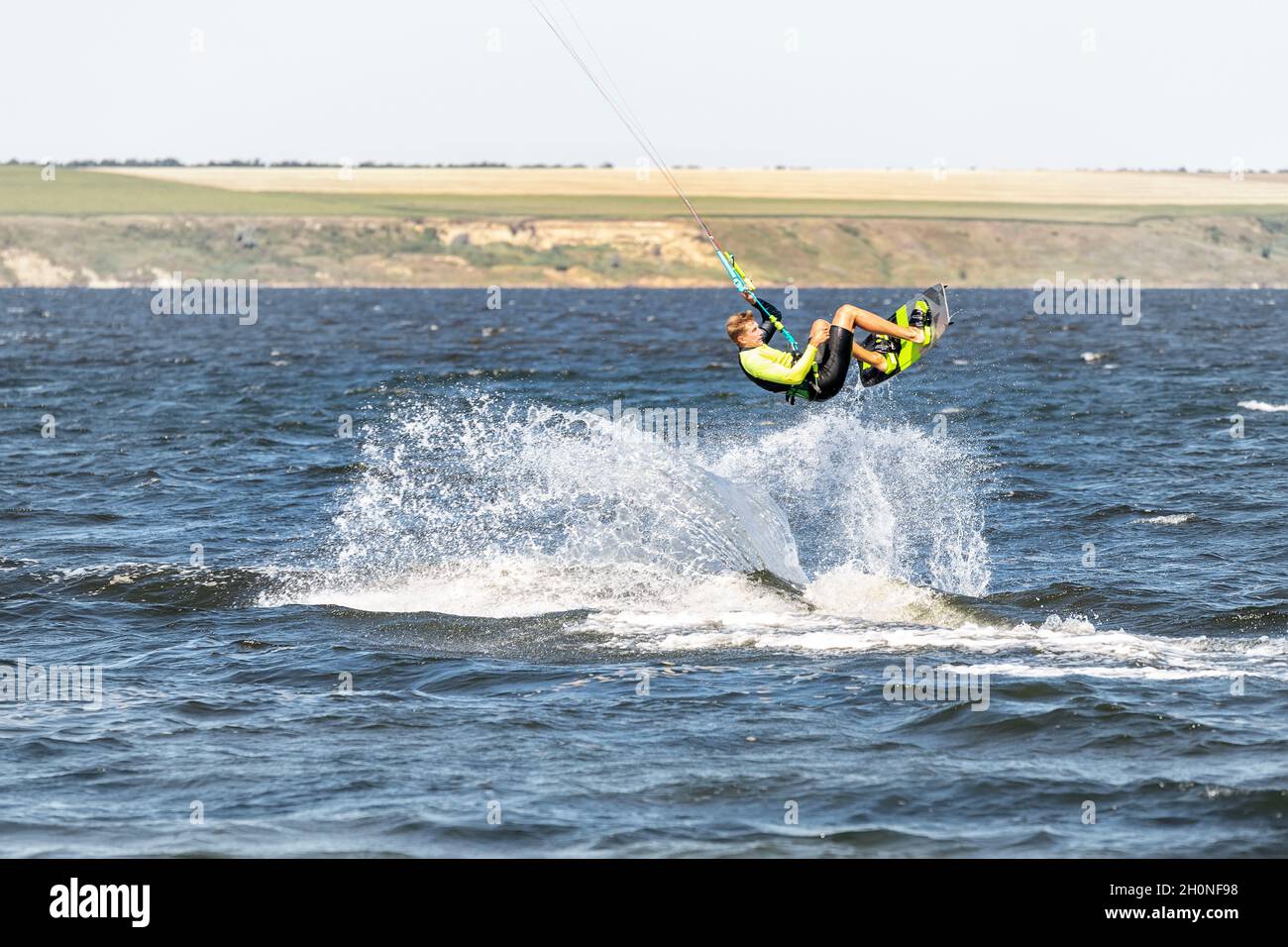 Young adult caucasian fit male person enjoy riding kite surf board ...
