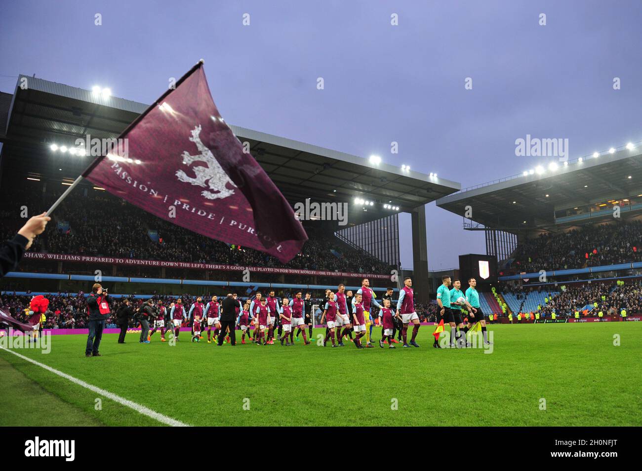 The teams walk onto the pitch Stock Photo - Alamy