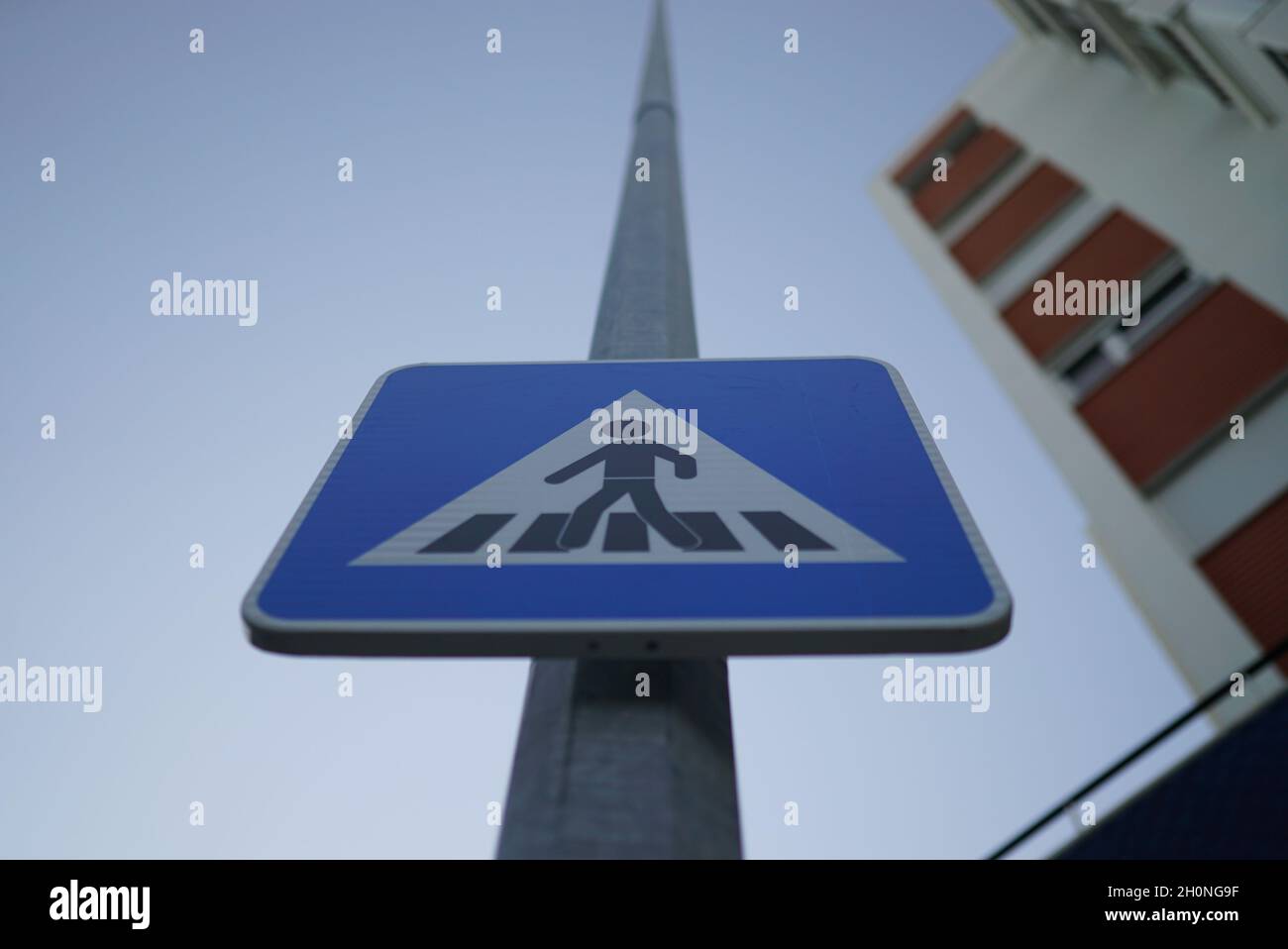 Low angle shot of a pedestrian crossing sign Stock Photo - Alamy