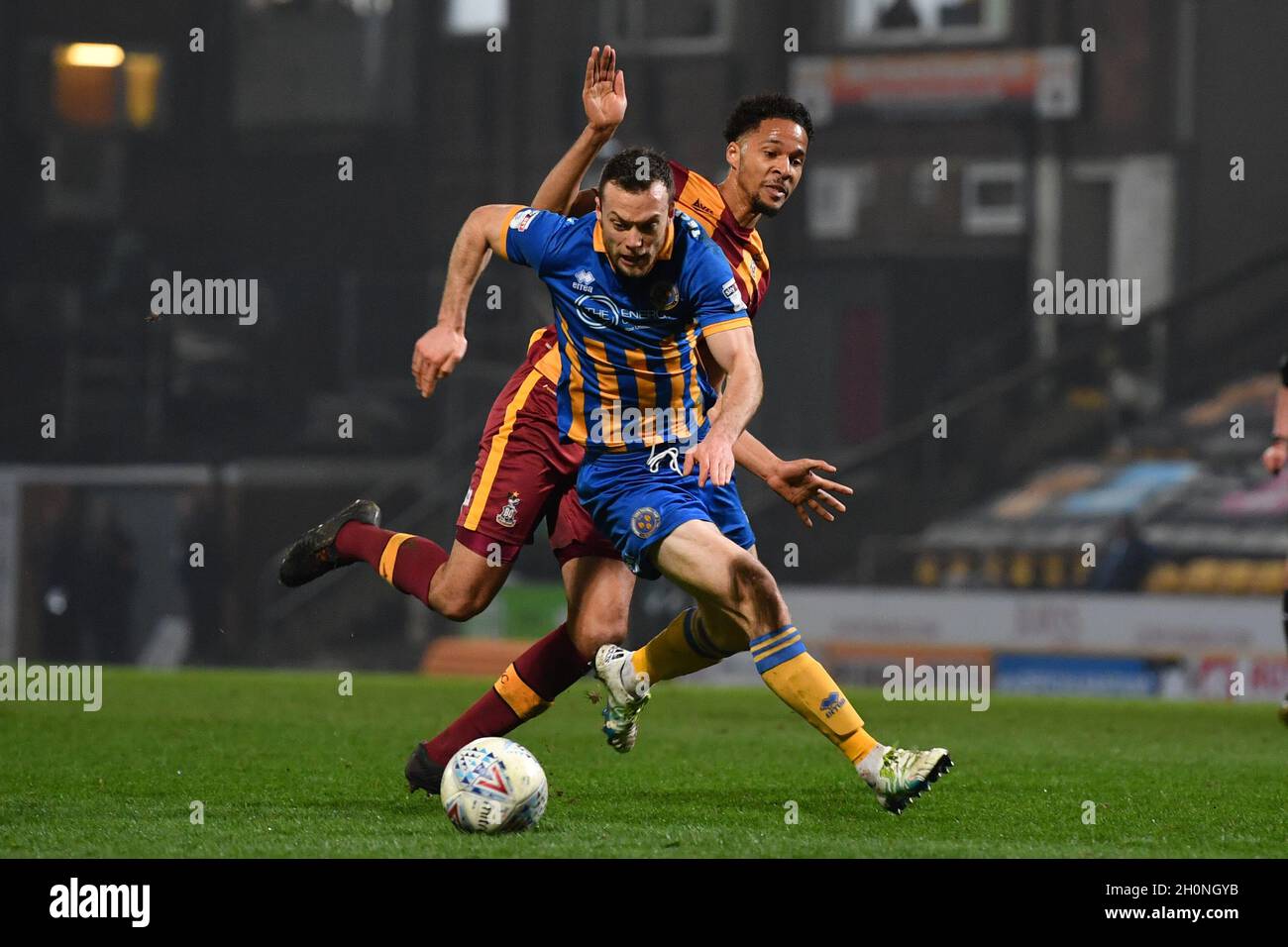 Shrewsbury Town’s Shaun Whalley goes past Bradford City’s Timothy Dieng ...