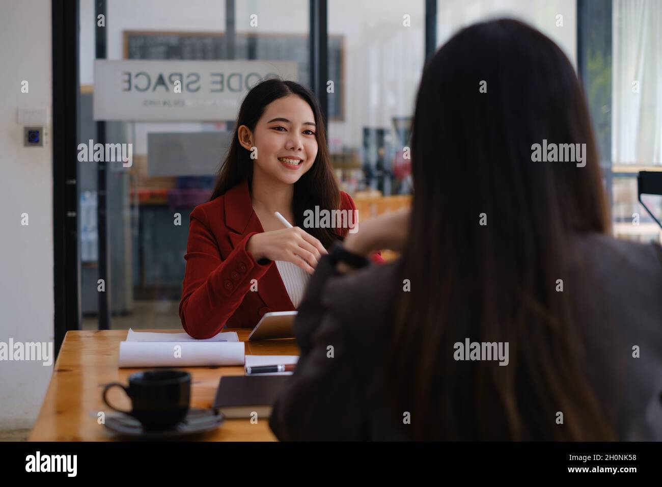 During a job interview, Woman in a suit and gives a presentation about ...