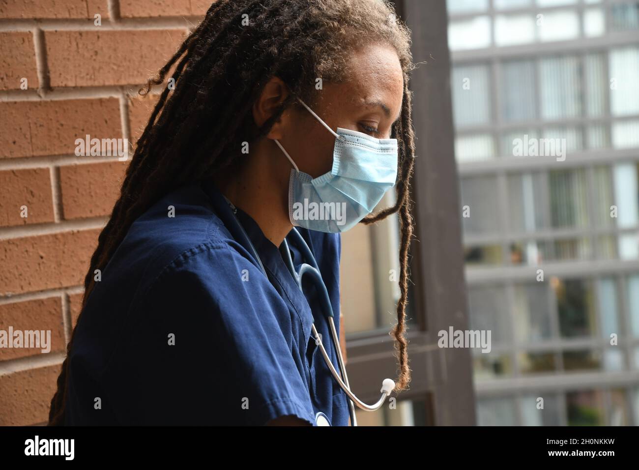 Female doctor with long dreads Stock Photo - Alamy